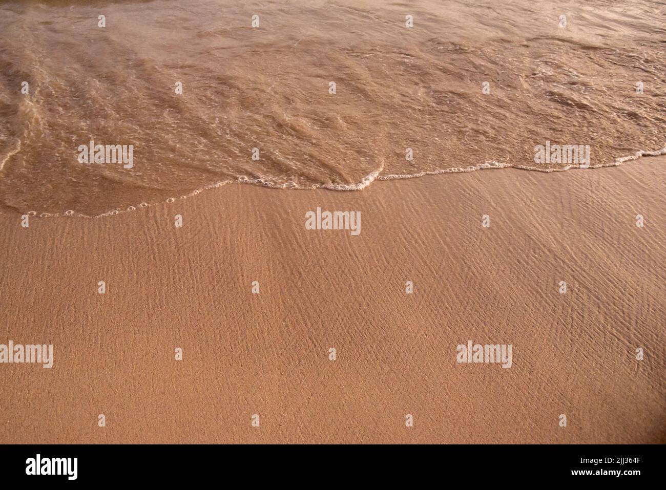 Beach shoreline with white waves breaking on the shoreline Stock Photo ...