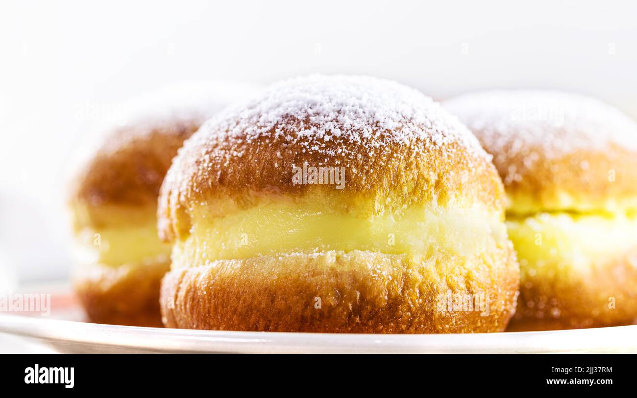 sweet bread or donut with sugar and stuffed with cream, called in ...