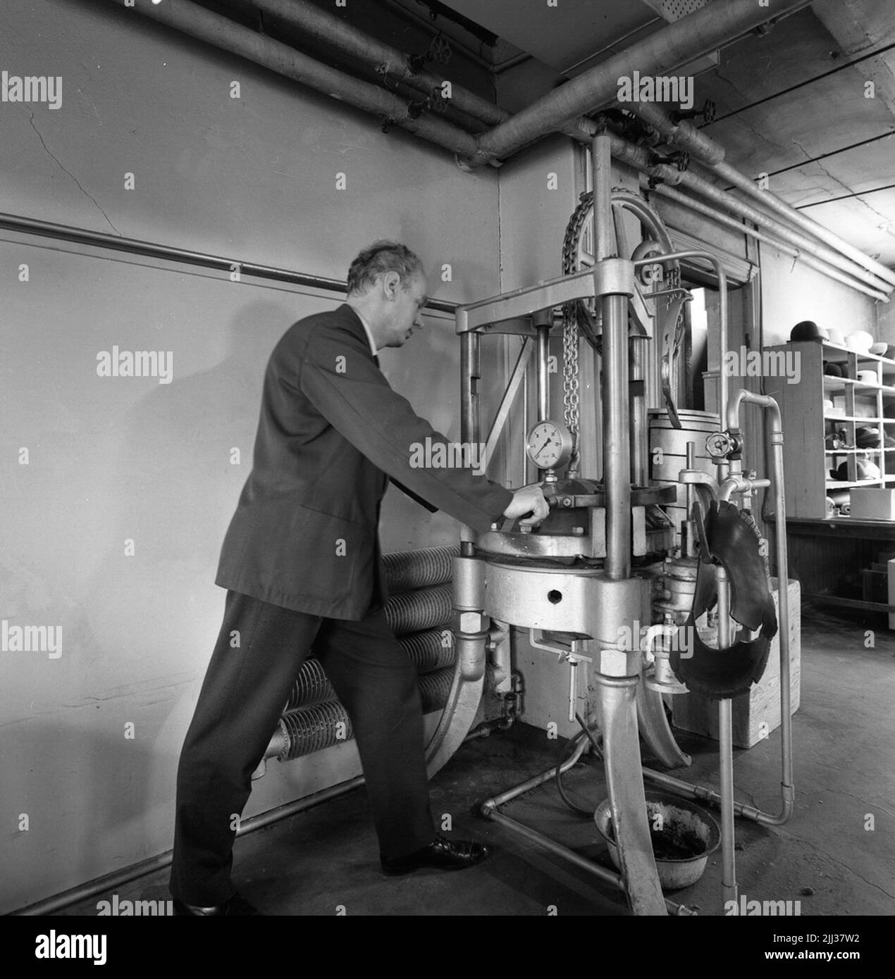 Hat production. 209/67 Press machine with the lid folded down. Lindberg ...