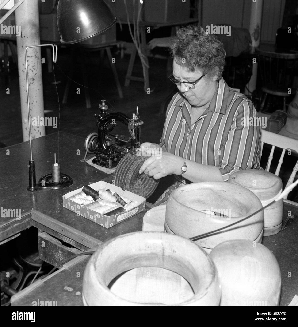 Hat production 228/67 The narrow straws are sewn together and formed ...