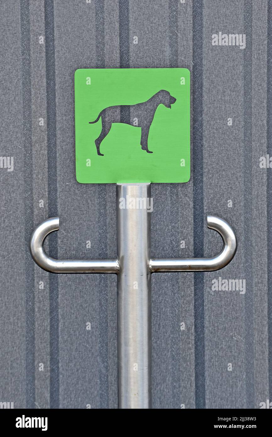 dog area parking closeup, green metal sign with silver hangs, pets ...