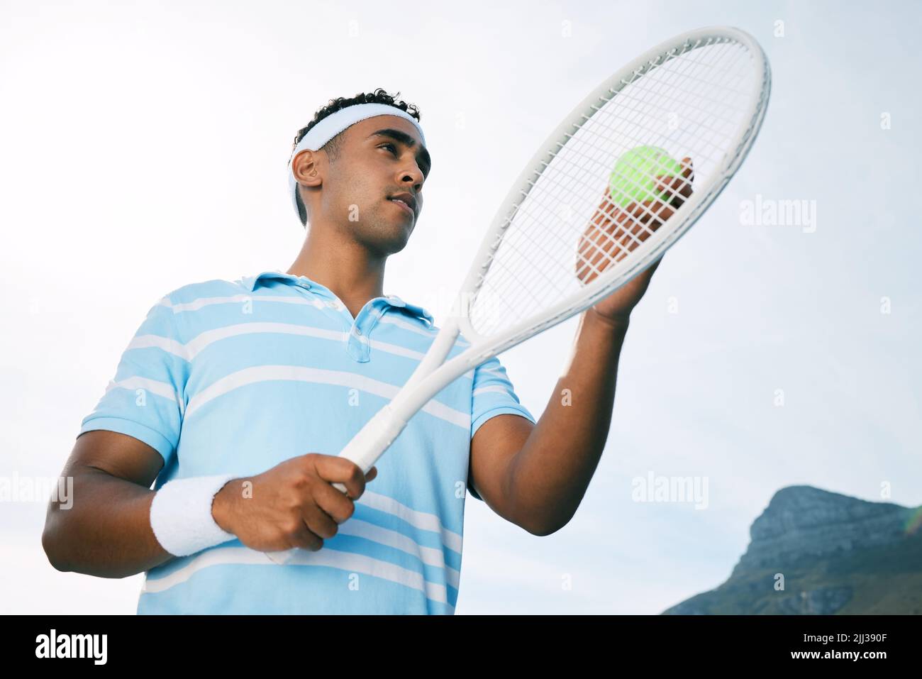 Make the most of today. a handsome young man getting ready to serve a ...