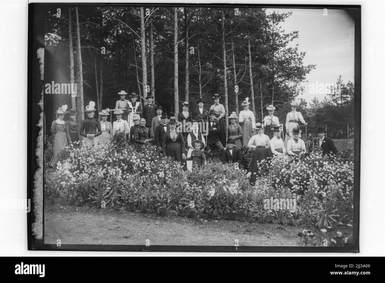 Group men children seated Black and White Stock Photos & Images - Alamy