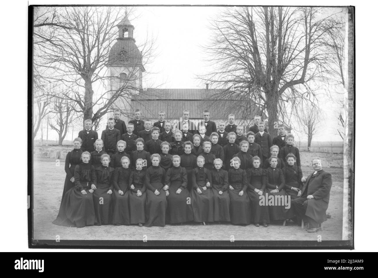 Ekeby church in the background.Confirmander, 47 reading children and ...