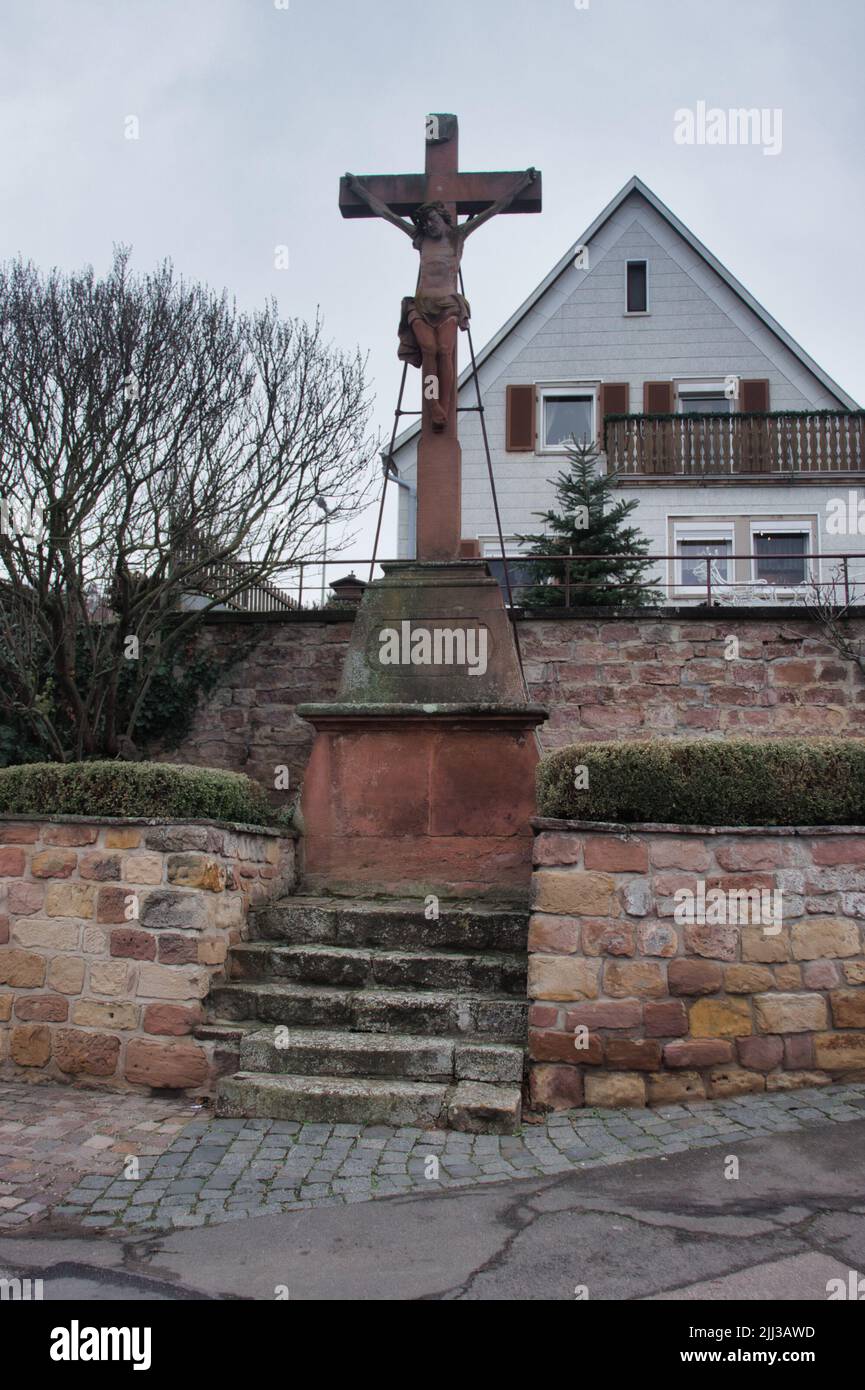 Neuleiningen, Germany - December 2, 2020: Statue of Jesus on a cross in ...