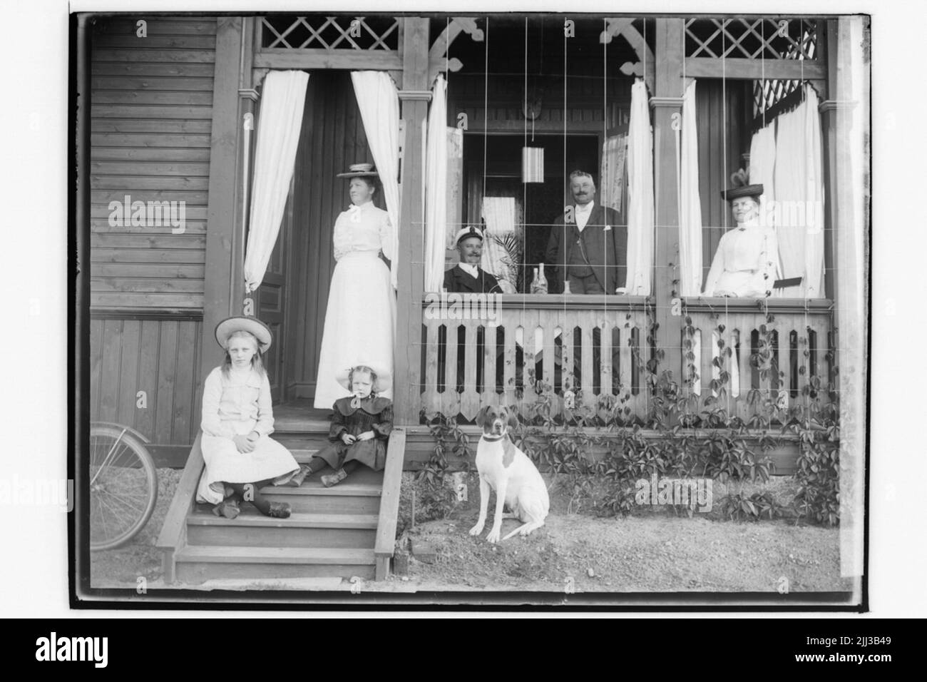 6 people and a dog, on the porch. Wife Elsa Roth Stock Photo - Alamy
