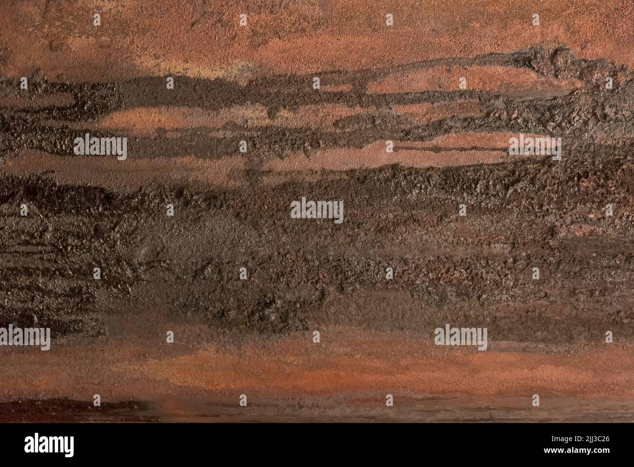 Brown rusty metal surface with dark traces of fuel oil old steel ...