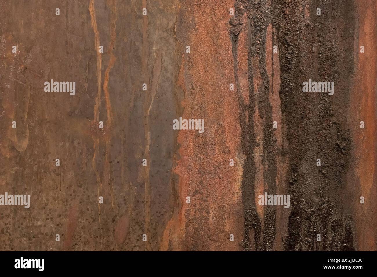Brown rusty metal surface with dark traces of fuel oil old steel ...