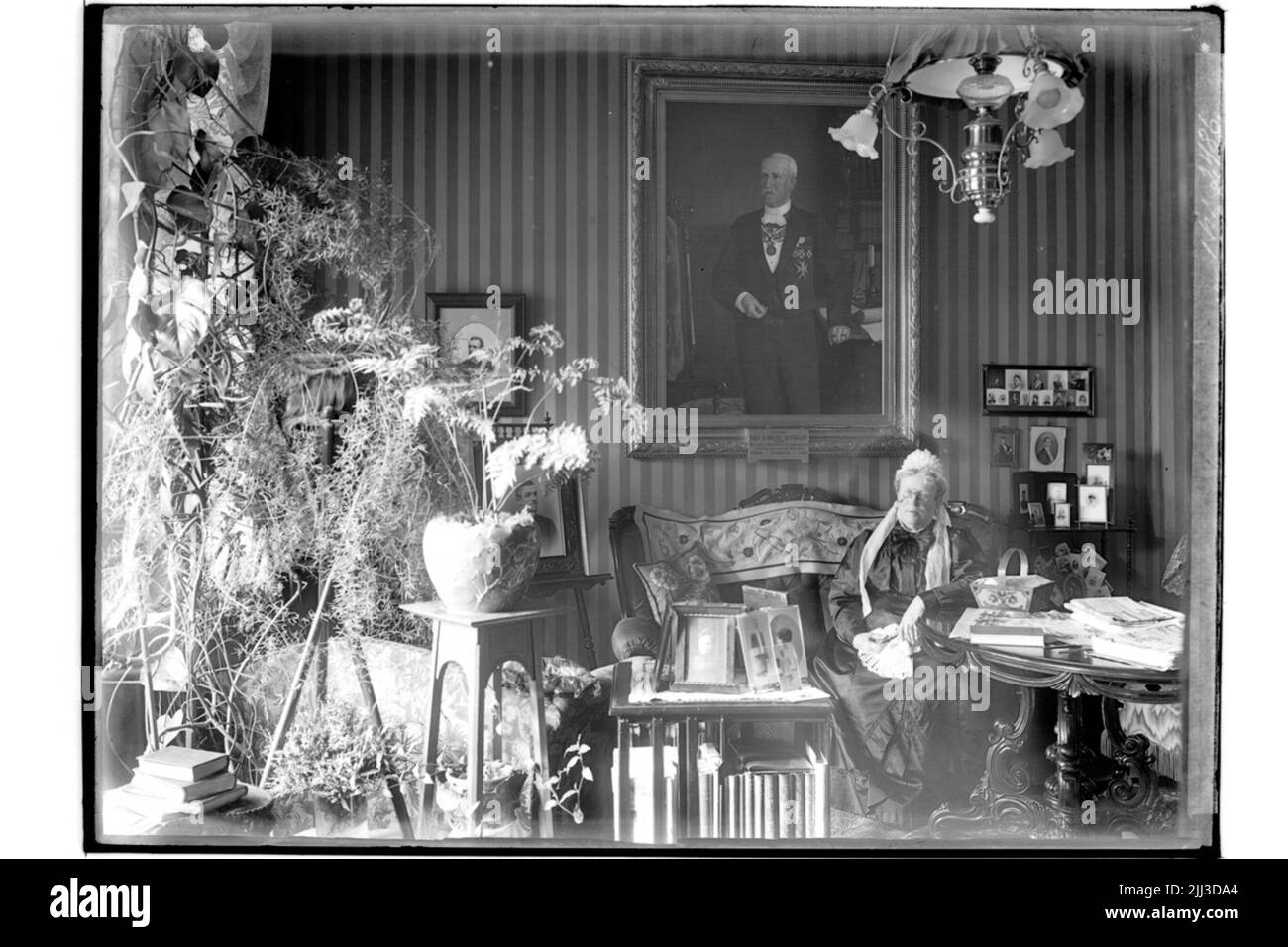 Room interior, an older lady. Freemason Thalie Djurklou Stock Photo - Alamy