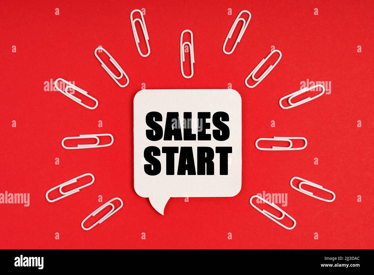 Business and finance concept. On a red background are paper clips and a ...