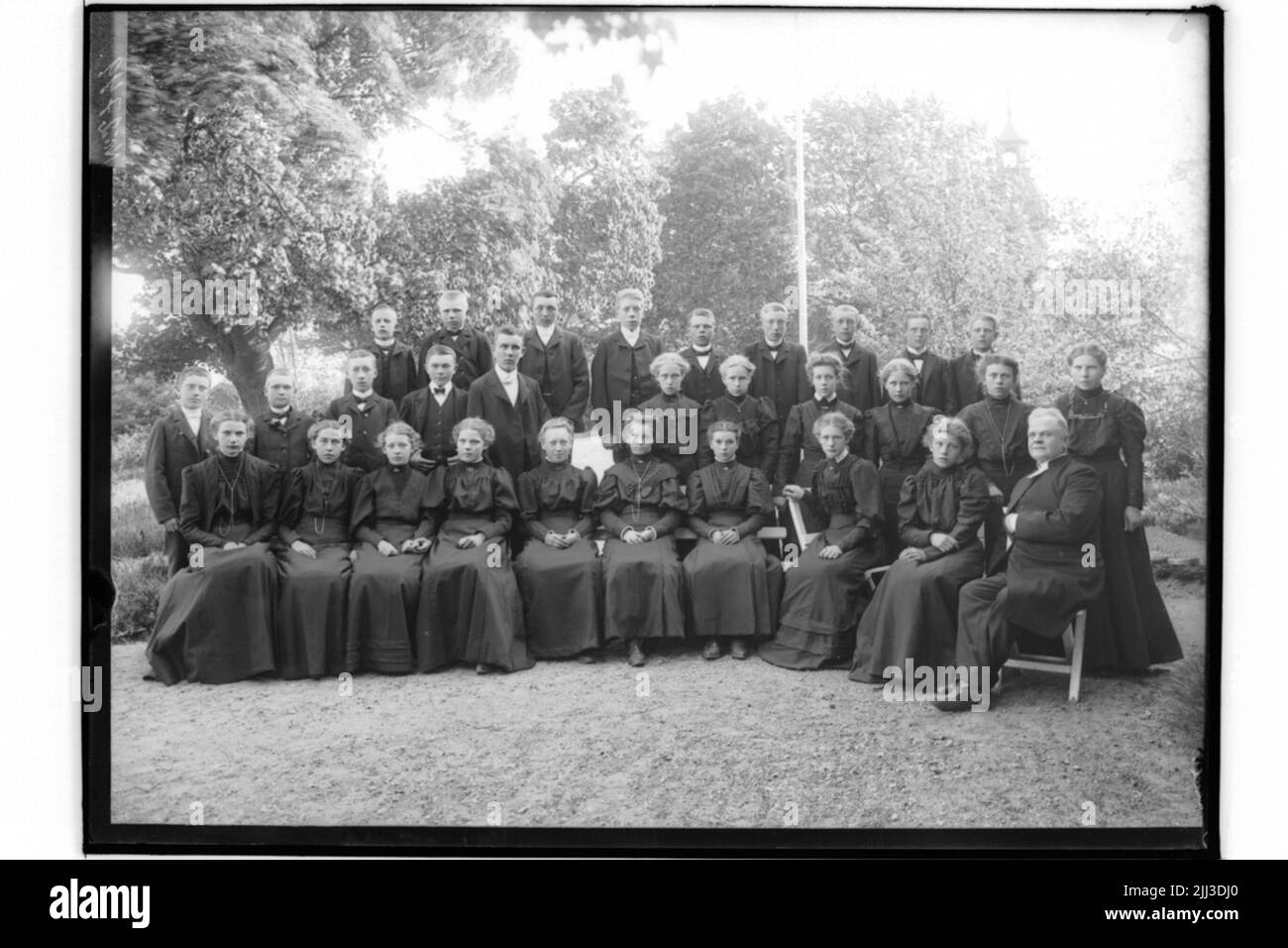 Confirmants, 29 reading children and a priest Stock Photo - Alamy