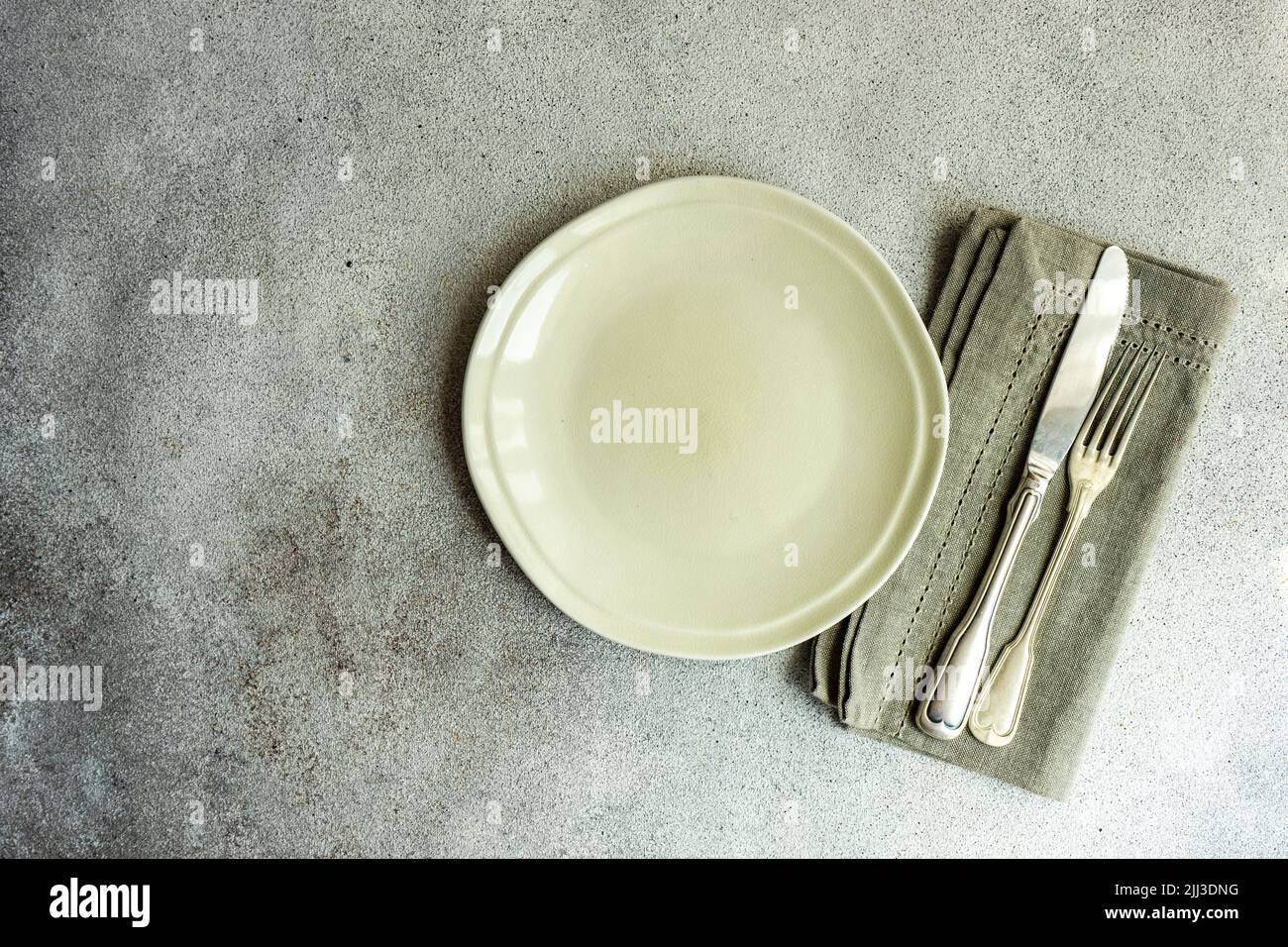 Overhead table setting in minimalistic style on concrete background ...