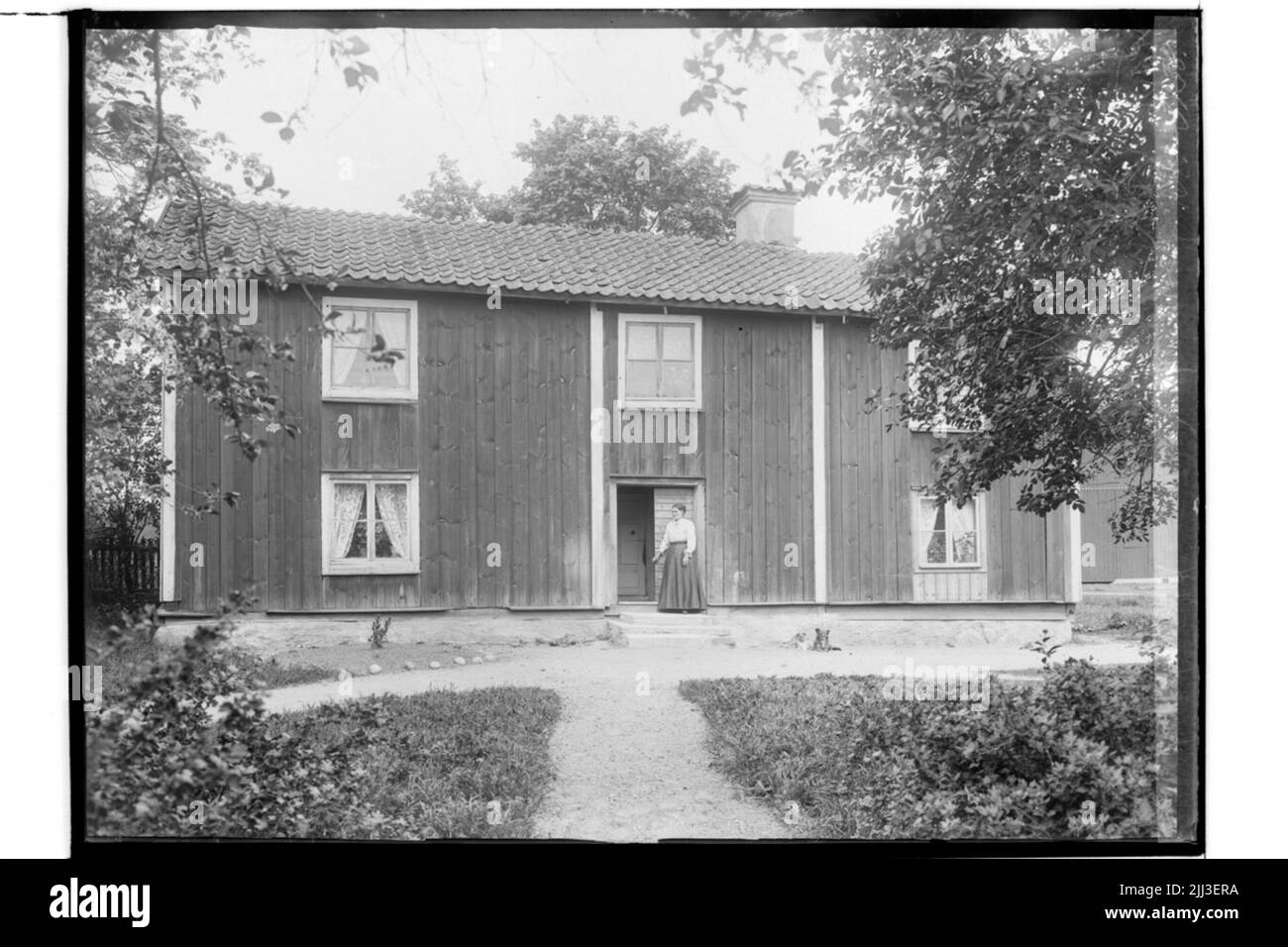 Two -storey couple's cottage, a woman. Wife Anna Hedkvist Stock Photo ...