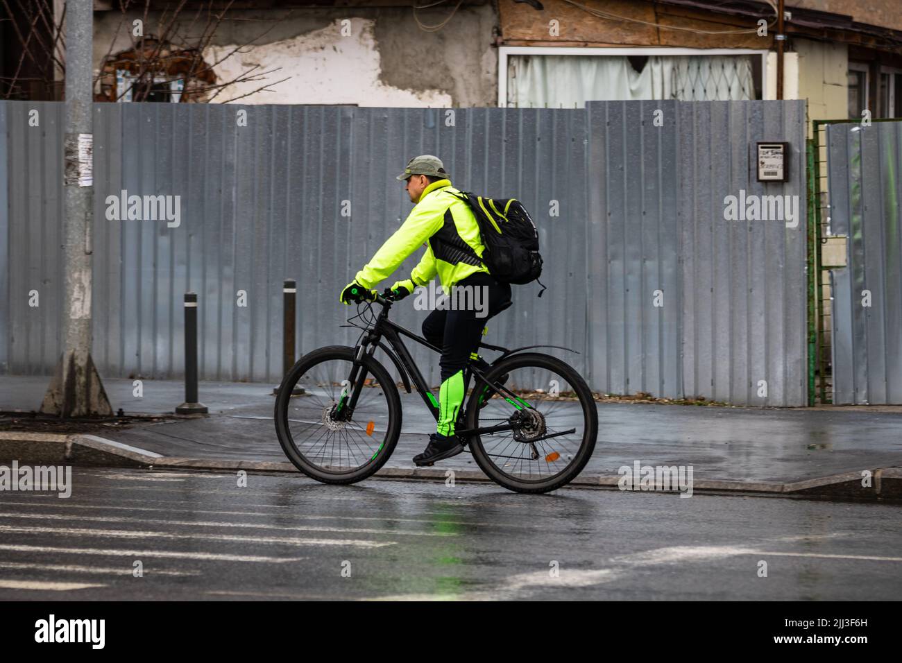 Riding a bicycle on the city streets. Commute to work in Bucharest ...