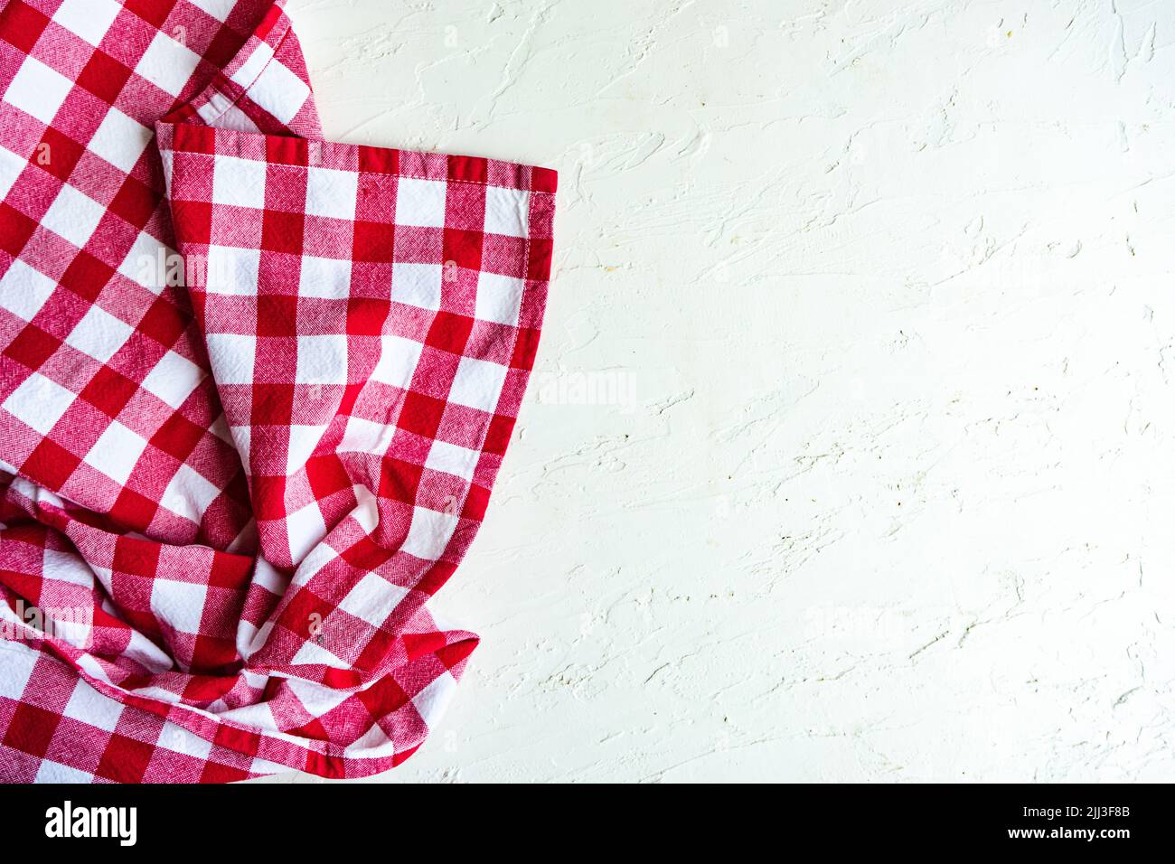 Kitchen textile towel on concrete table background with copy space ...