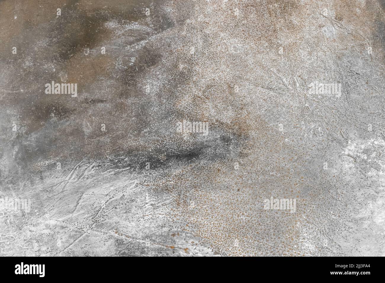 Dirty streaks of white and gray paint on the surface of old metal ...