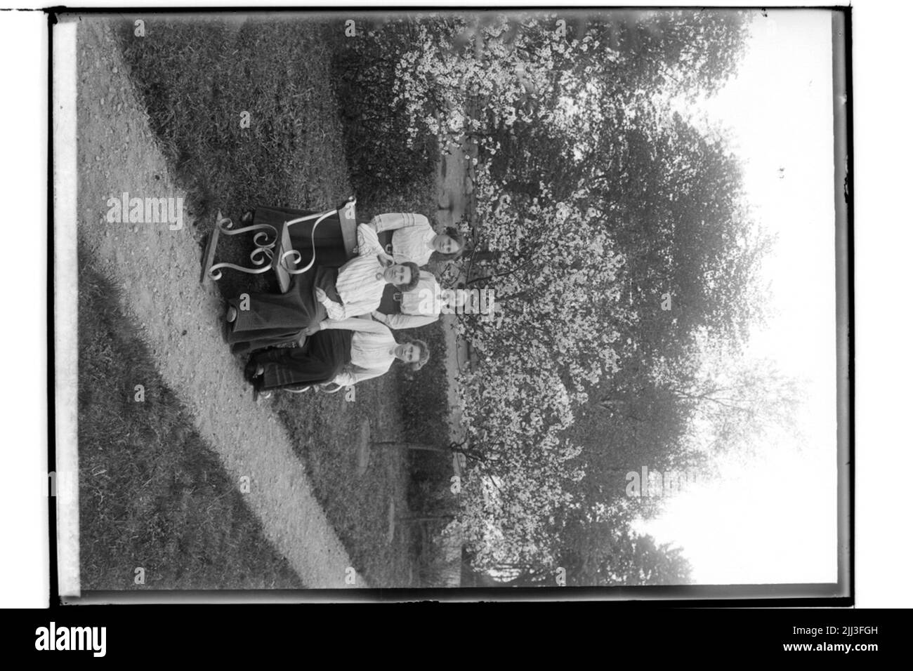 Four women sitting in Black and White Stock Photos & Images - Alamy
