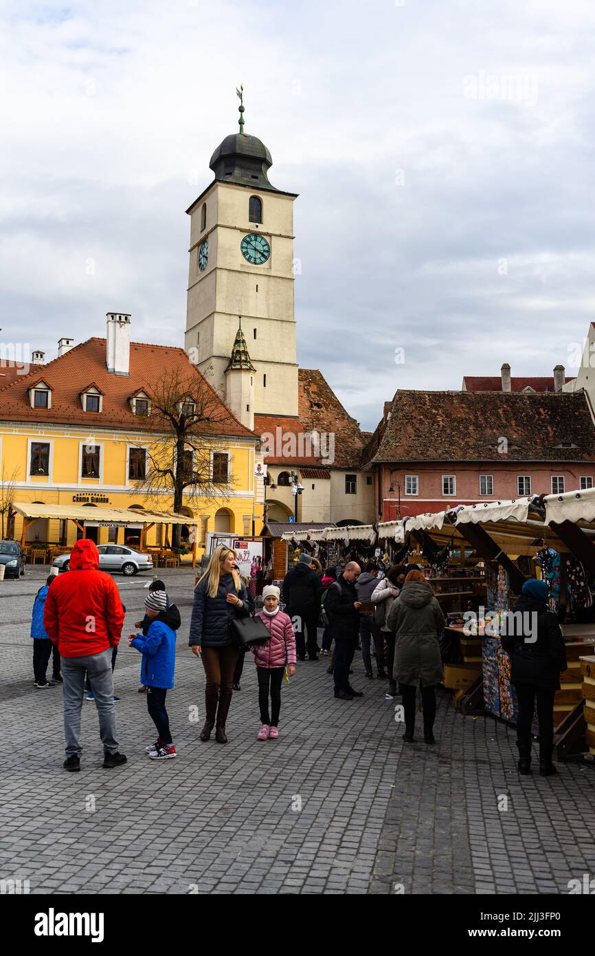 People and tourists wandering on the streets of old town Sibiu, Romania ...