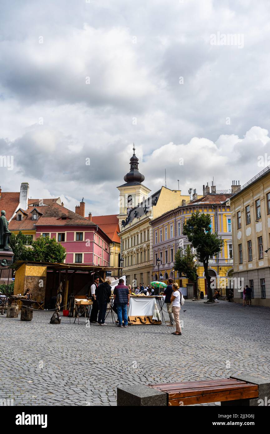 People and tourists wandering on the streets of old town Sibiu, Romania ...