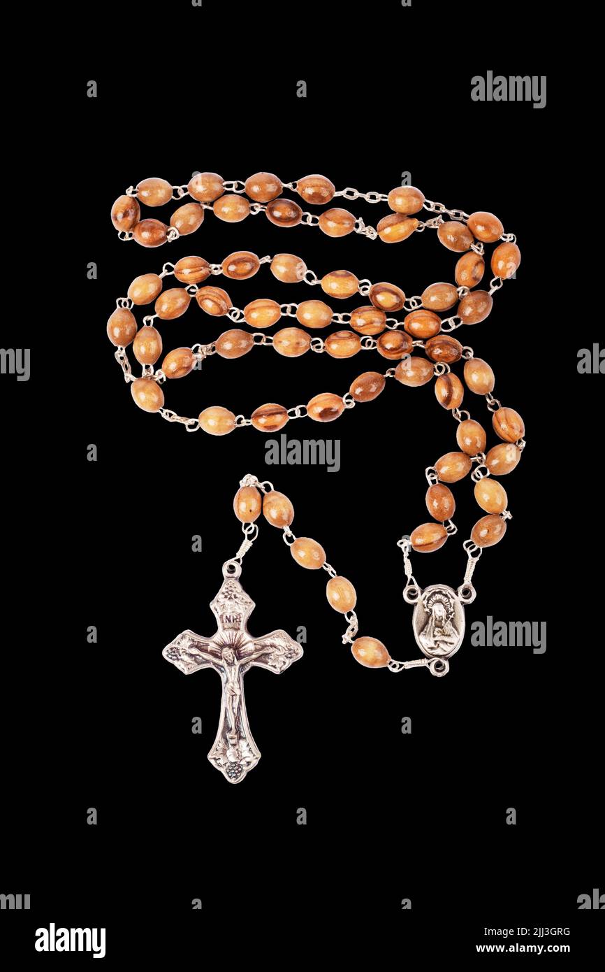 Traditional Christian holy religious wooden rosary isolated on black ...