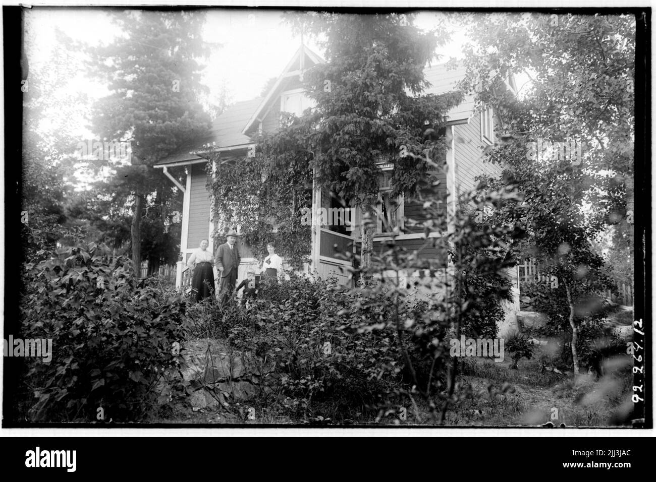 Hålahult's sanatorium, exterior, three adults and one child outside ...