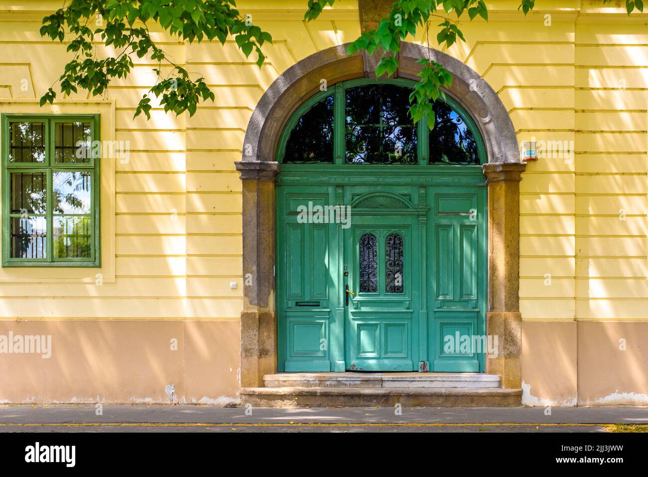 Front of the old building (facade), historic wooden door (gate ...