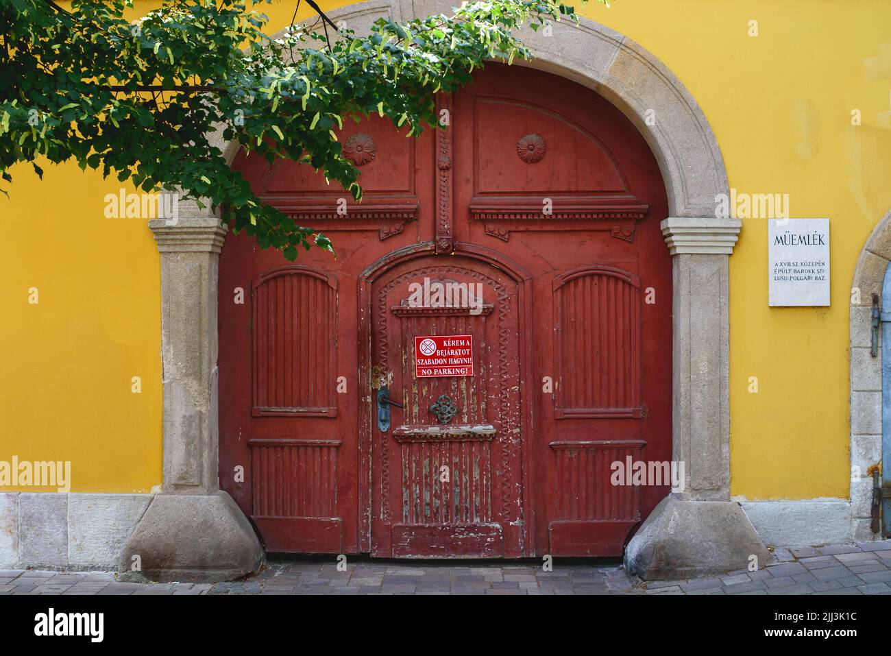 Front of the old building (facade), historic wooden door (gate ...
