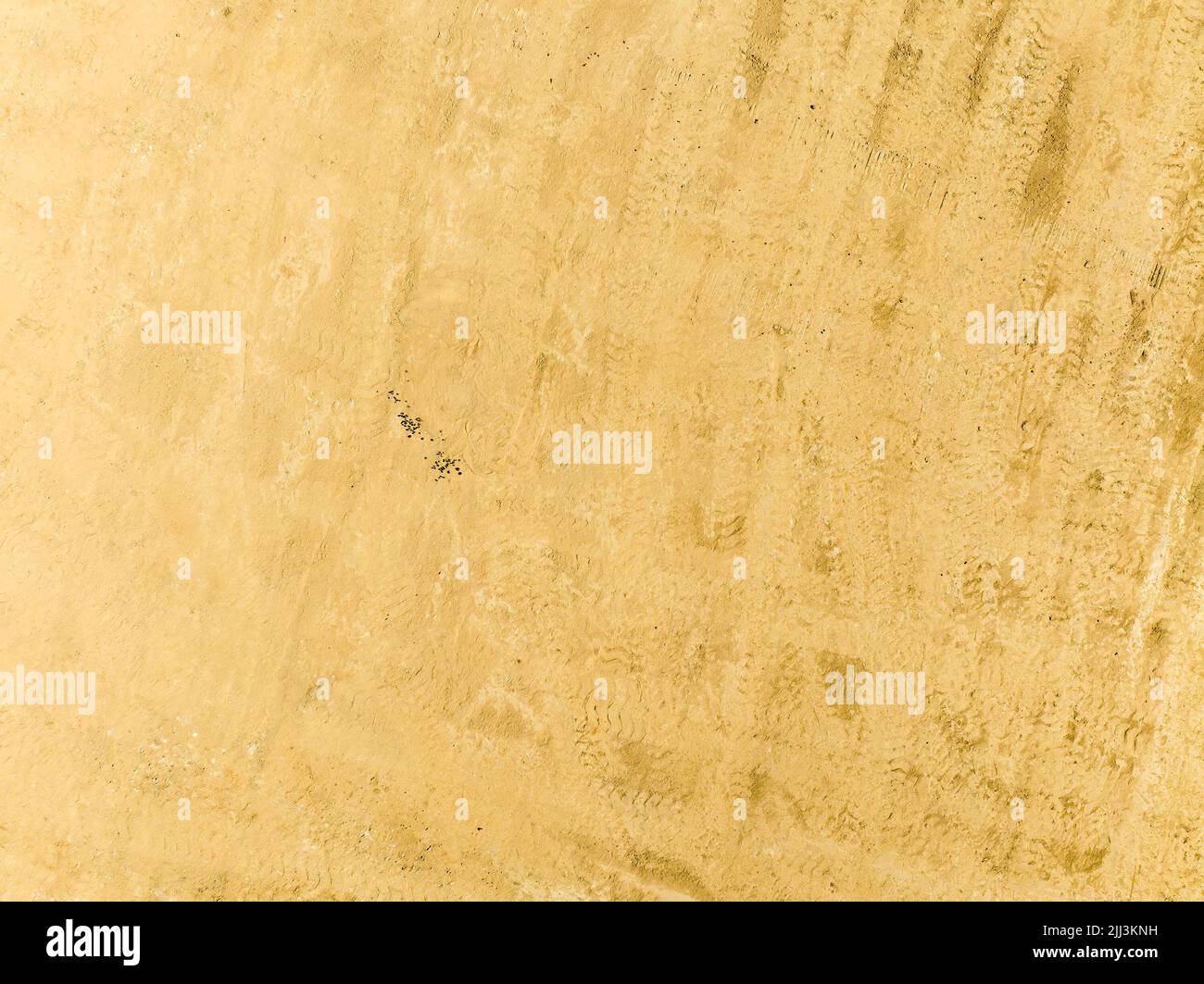 Drone aerial looking down onto bare ground on the mine diggings on the ...