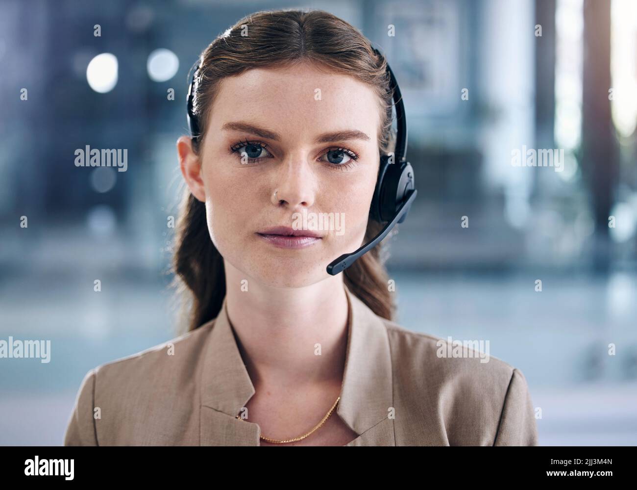 Shes your first point of contact. Portrait of a young call centre agent ...