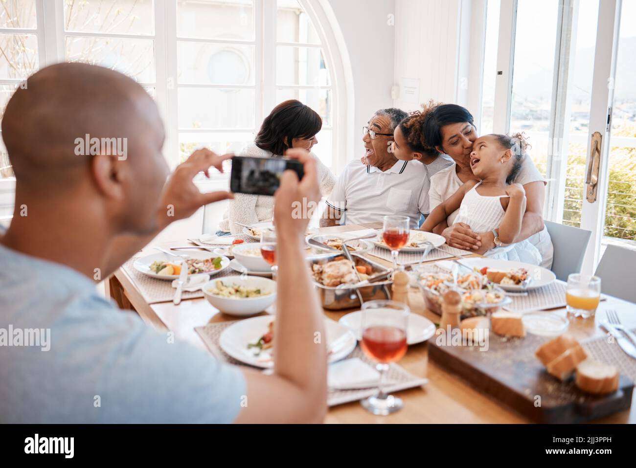 Your smiles will forever be immortalized. a young father taking photos ...