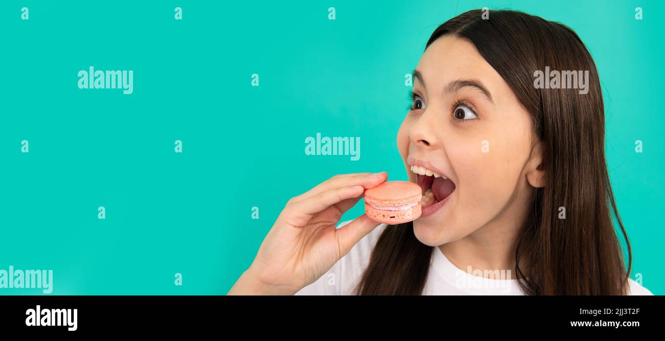 amazed child eat french macaron or macaroon cookies, sweet tooth ...