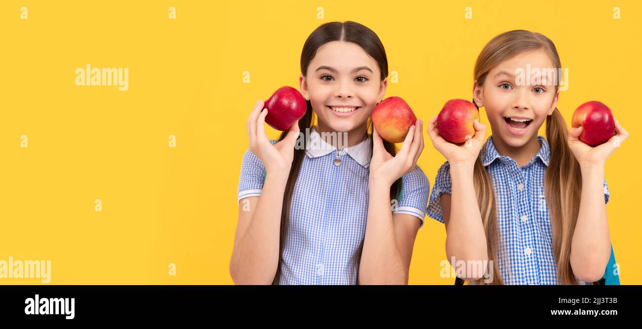 Happy children back to school holding apples for healthy eating ...