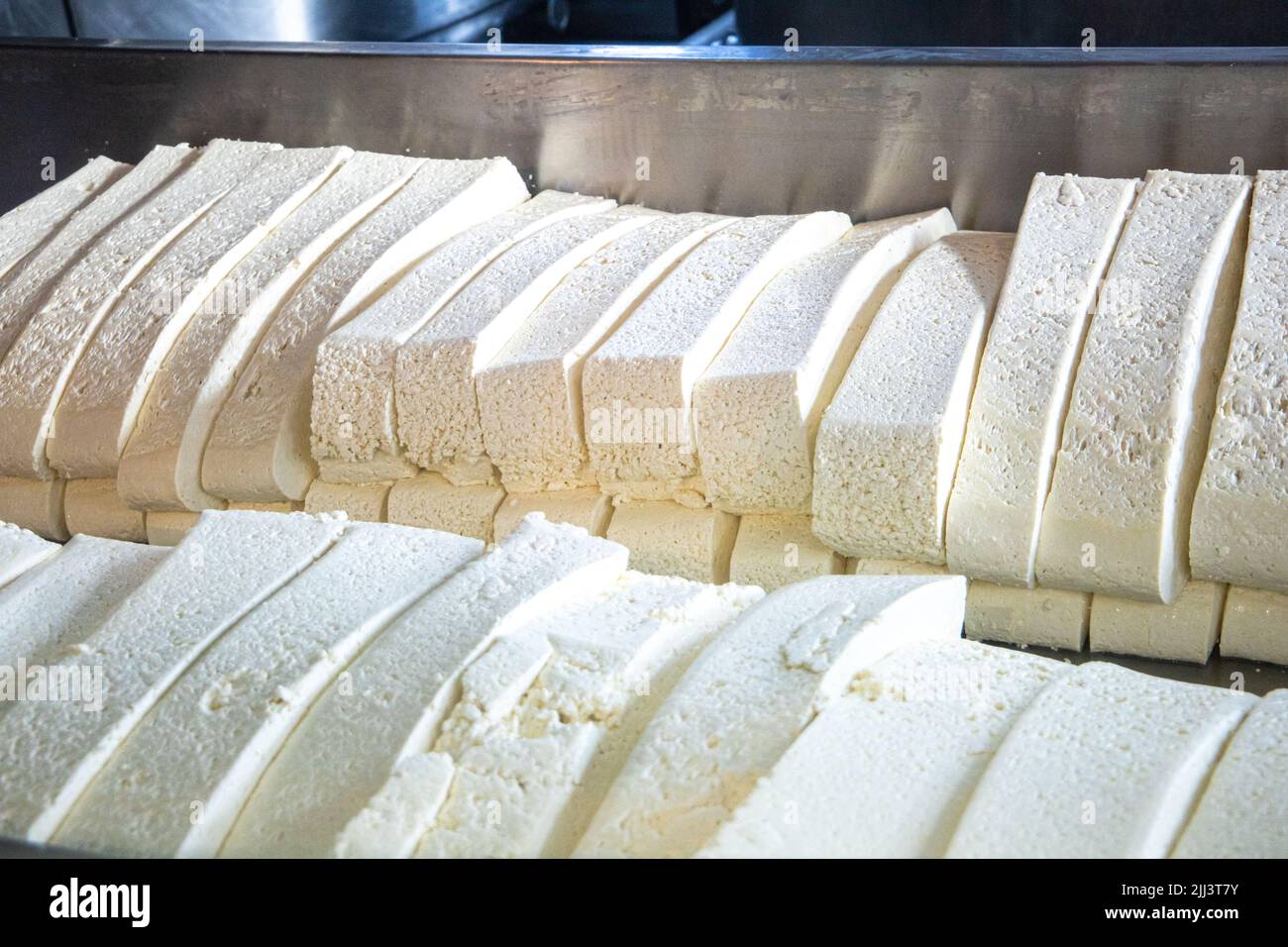 Fresh cheese made and ready for packaging Stock Photo - Alamy
