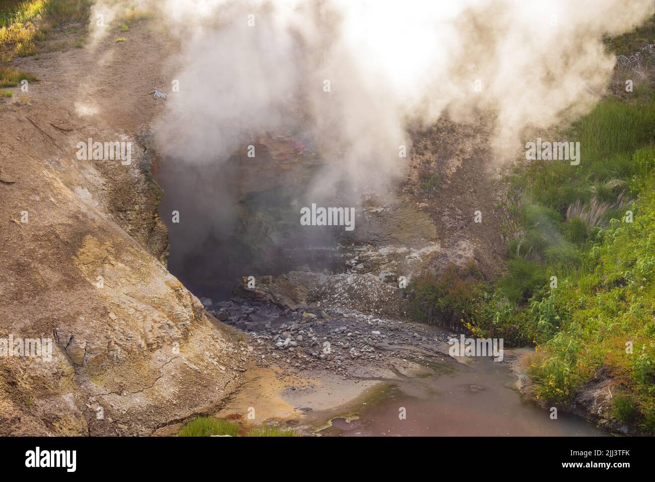 Sunny view of the Dragon's Mouth Spring of Mud Volcano in Yellowstone ...