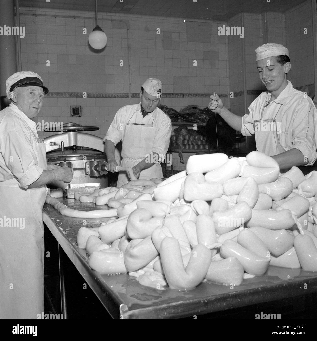 Christmas sausage at Gustafssons.december 1956 Stock Photo - Alamy