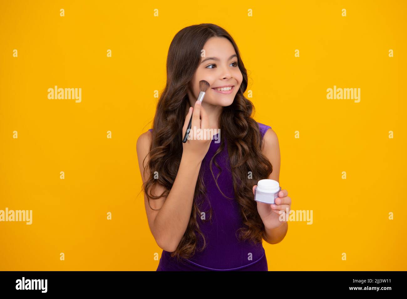 Kids make up products. Makeup teen child artist apply face powder with ...