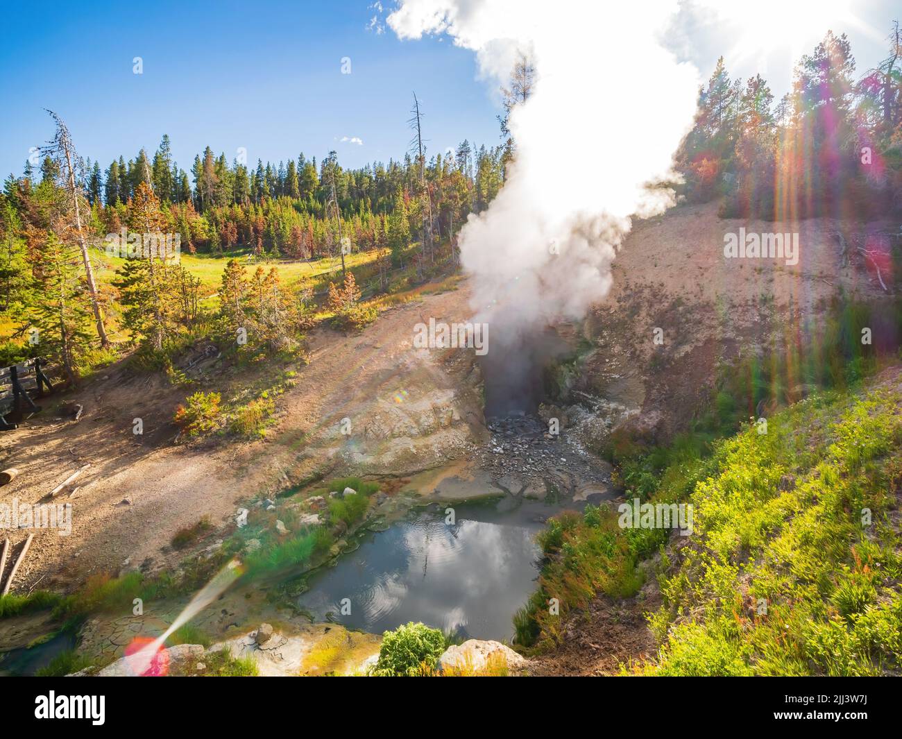 Sunny view of the Dragon's Mouth Spring of Mud Volcano in Yellowstone ...