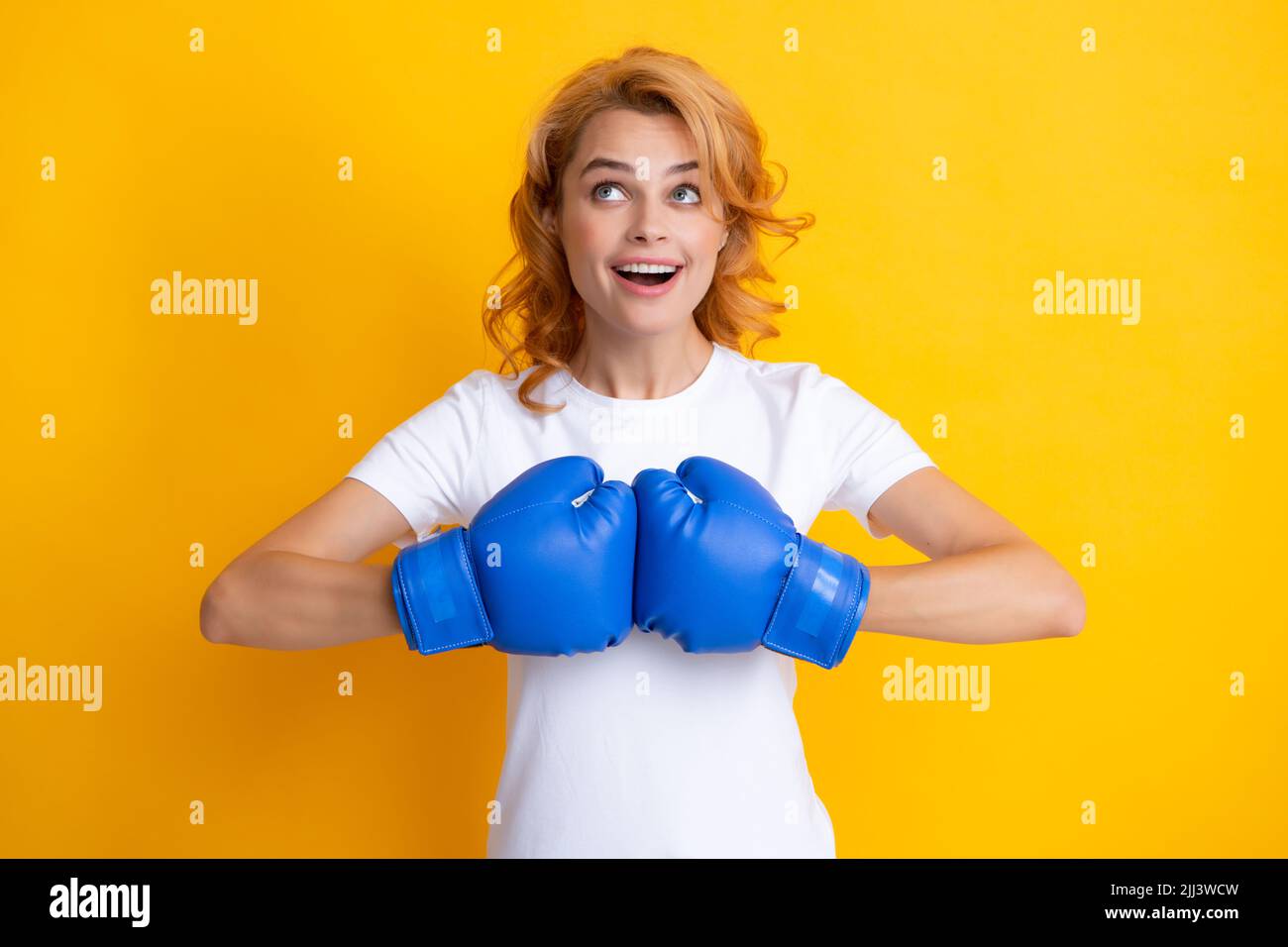 Funny woman in boxing gloves. Winning woman, success concept, isolated ...