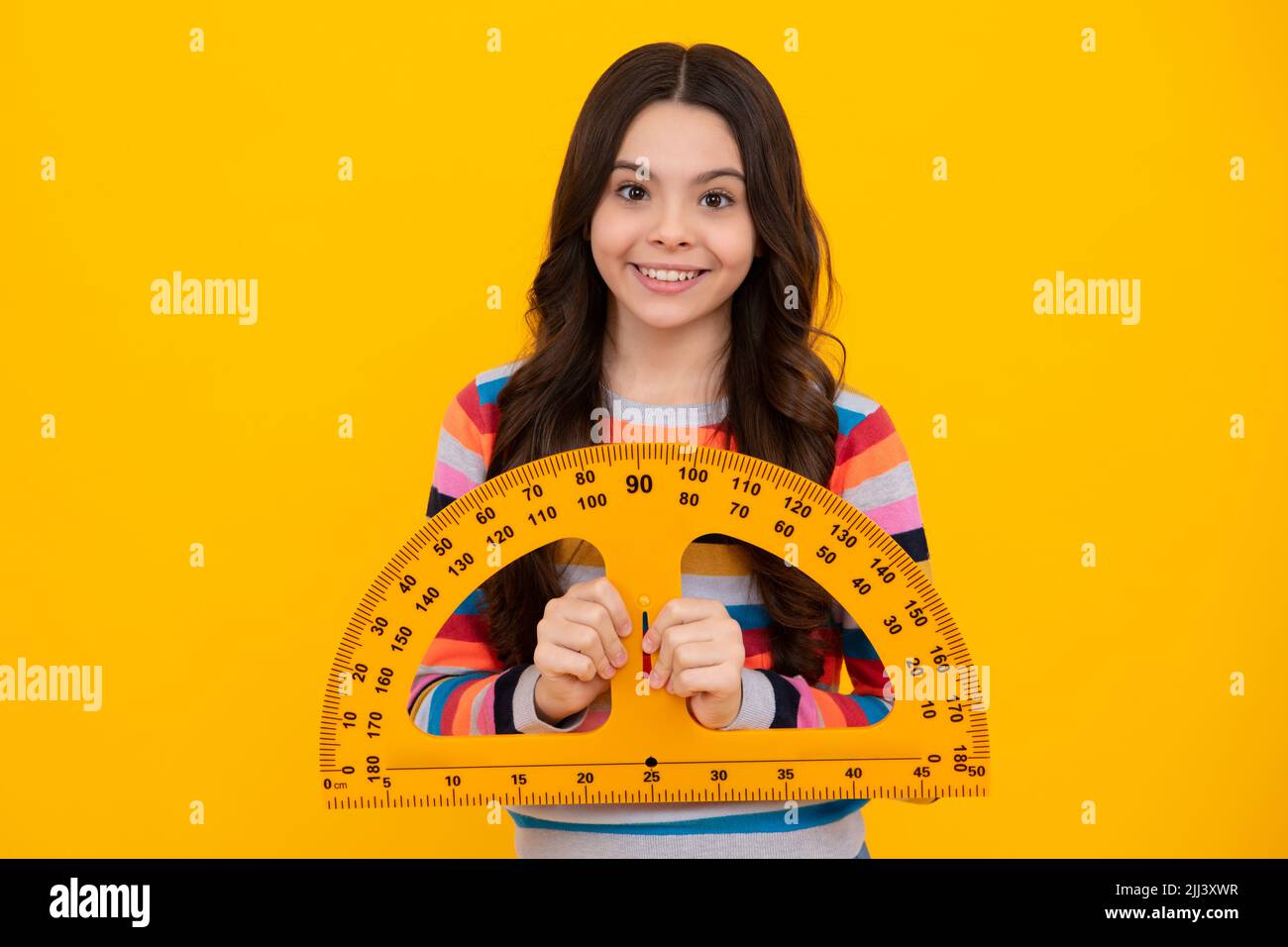 Teenager school girl study math or geometry lesson, measure the size ...