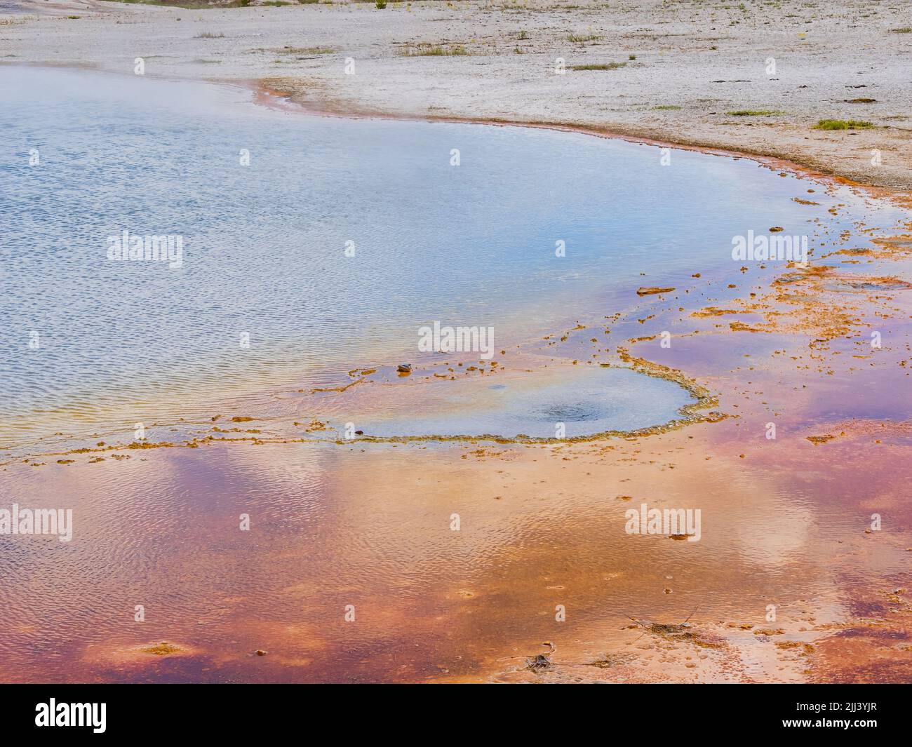 Sunny view of the landscape of Rainbow Pool of Black Sand Basin at ...