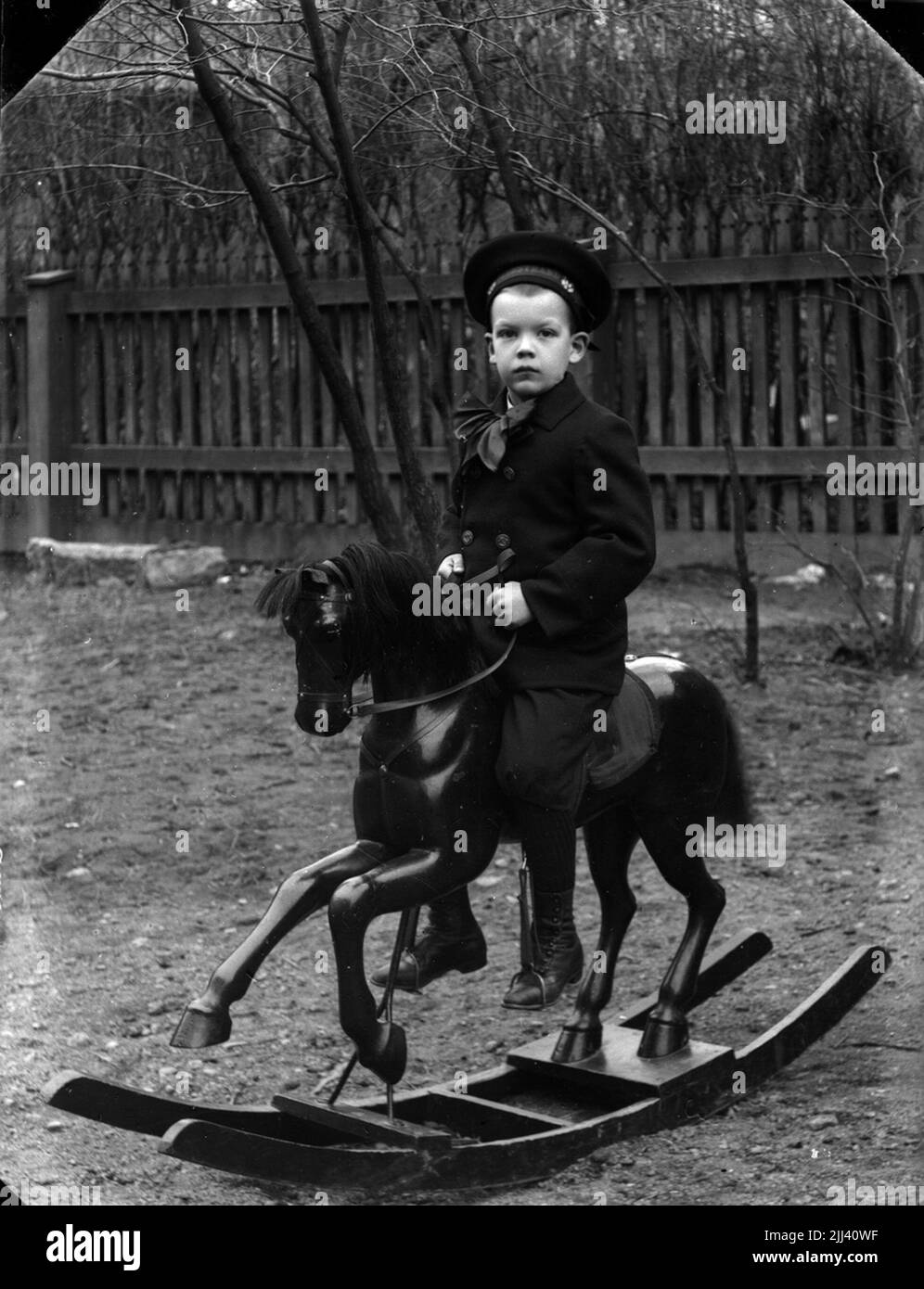 Boy on rocking horse Black and White Stock Photos & Images - Alamy
