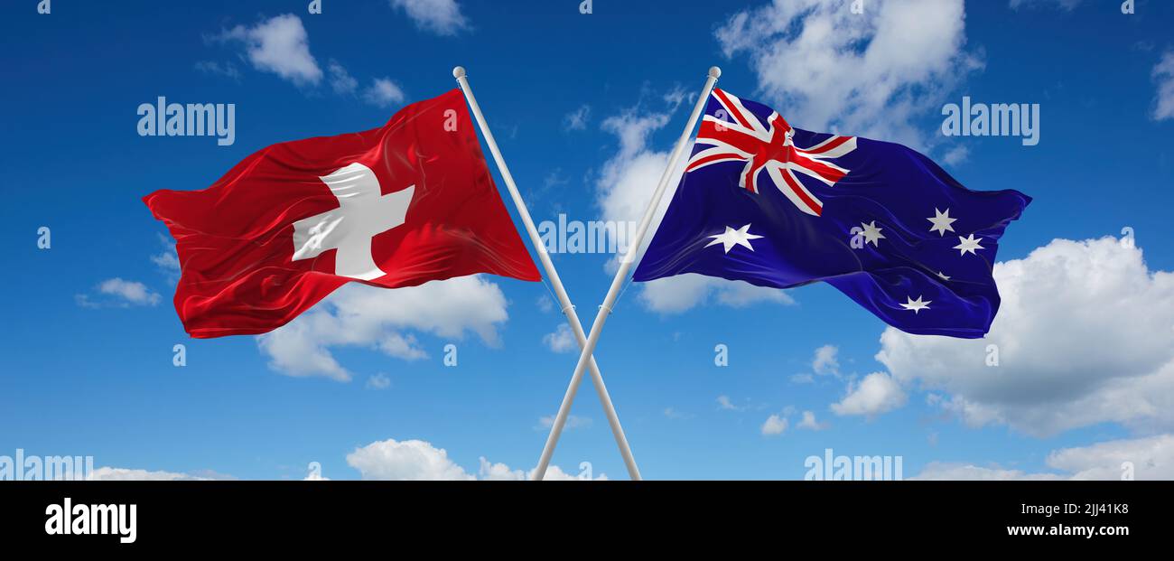 two crossed flags Australia and Switzerland waving in wind at cloudy ...