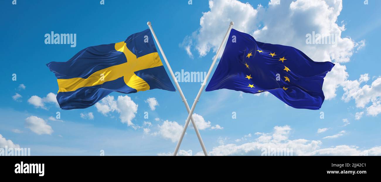 two crossed flags The European Union and Sweden waving in wind at ...