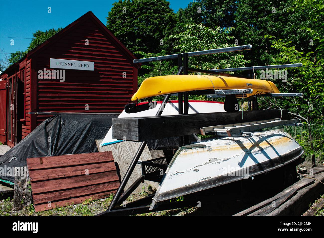 Several small boats racked in front of Trunnel Shed at the Essex ...