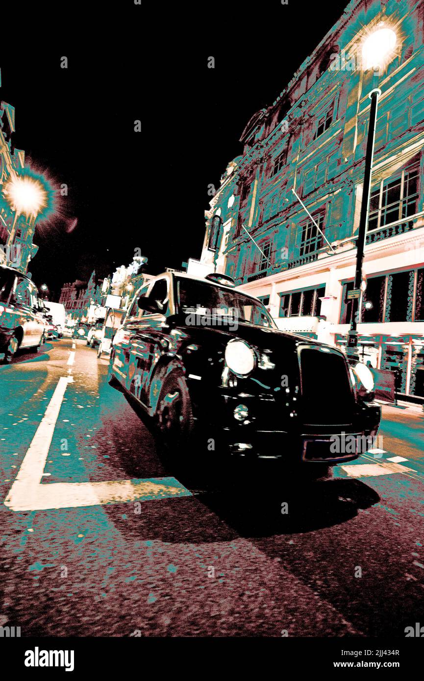 London black cab taxi driving on the street at night Stock Photo - Alamy