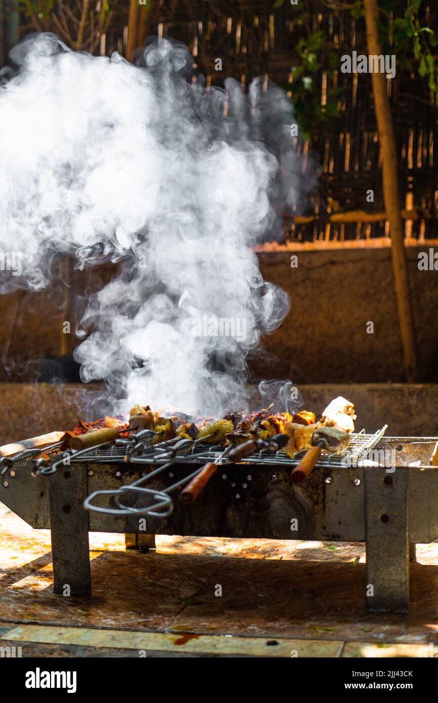 Moroccan barbecue smoke and delicious meat Stock Photo - Alamy