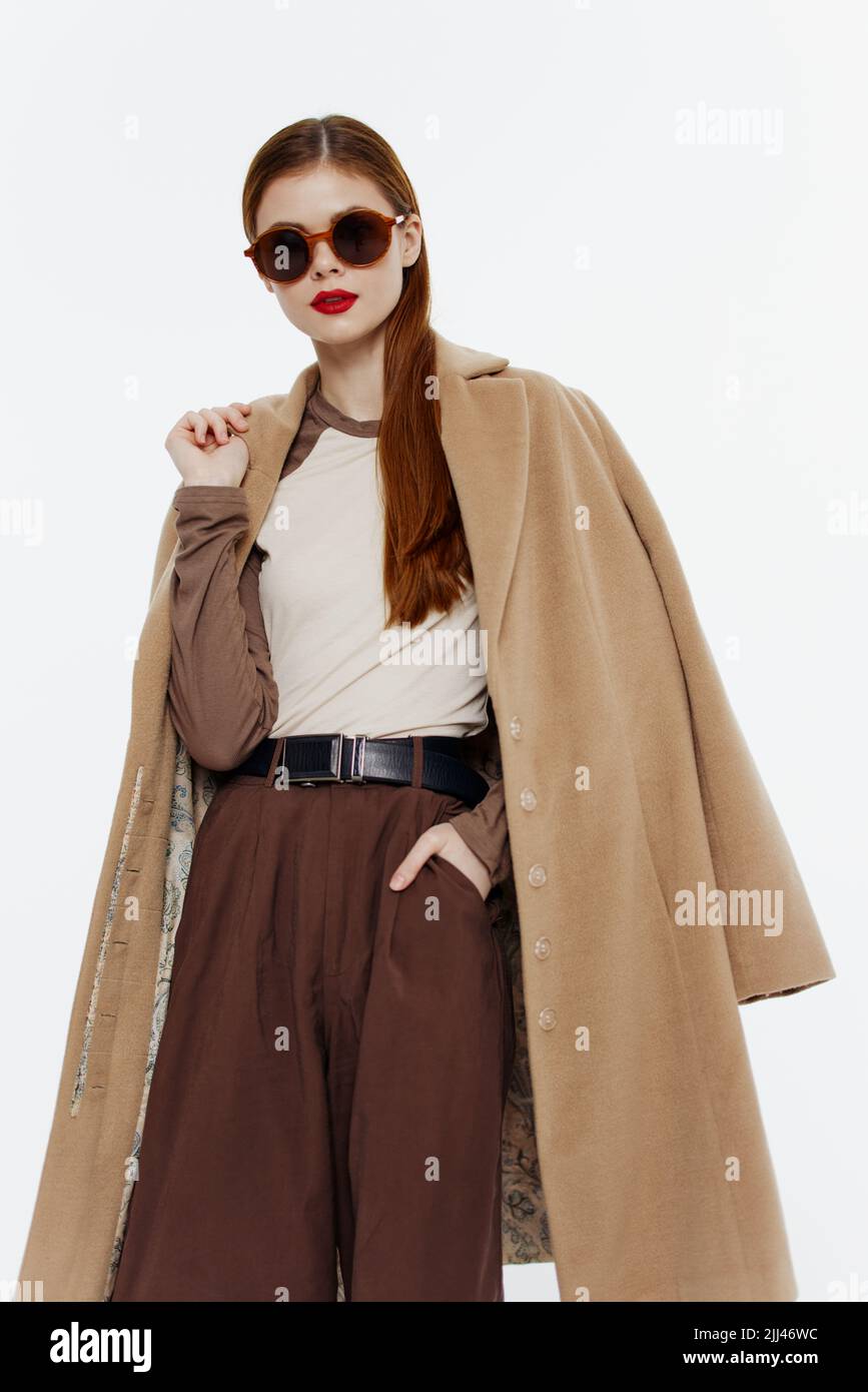 Hey, look at me concept. A spectacular elegant female model in a coat ...