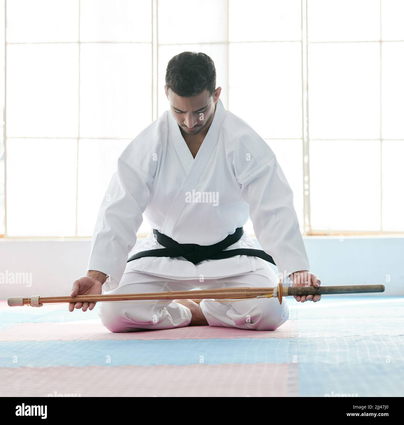 Picking up the mantel. Full length shot of a handsome young martial ...