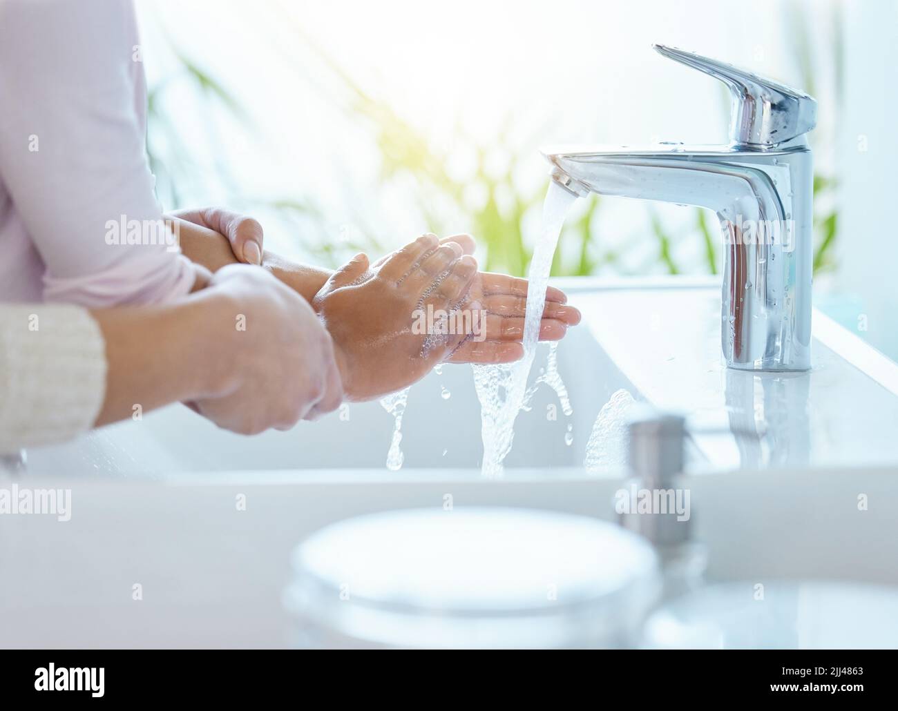 Wash all the germs away. an unrecognizable parent helping their child ... Wash all the germs away. an unrecognizable parent helping their child ...