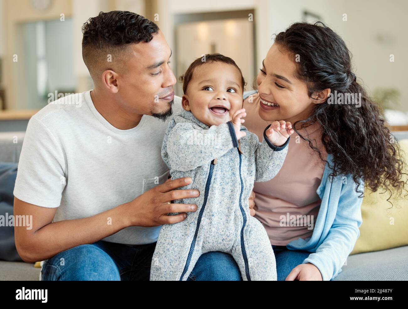They cant resist this little one. a young family bonding with their ...